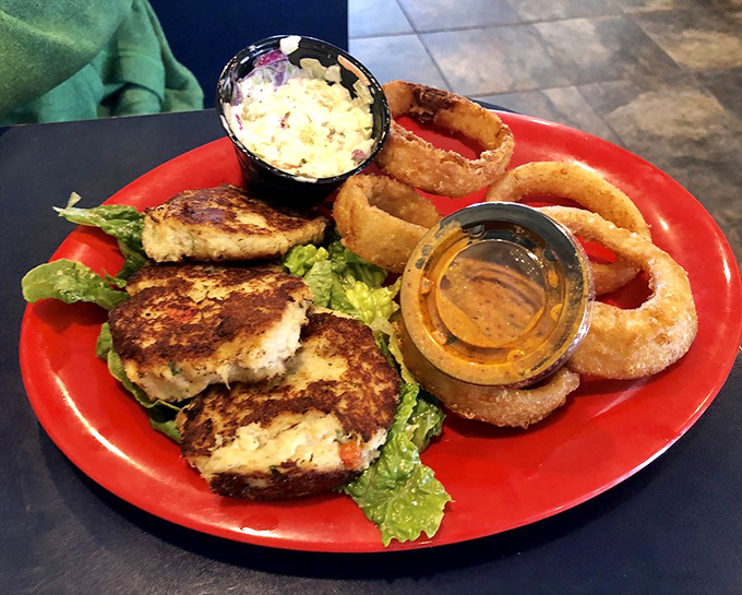 Crab cakes that actually taste like crab&mdash;what a concept! Served with those onion rings that make you temporarily forget about your diet promises.