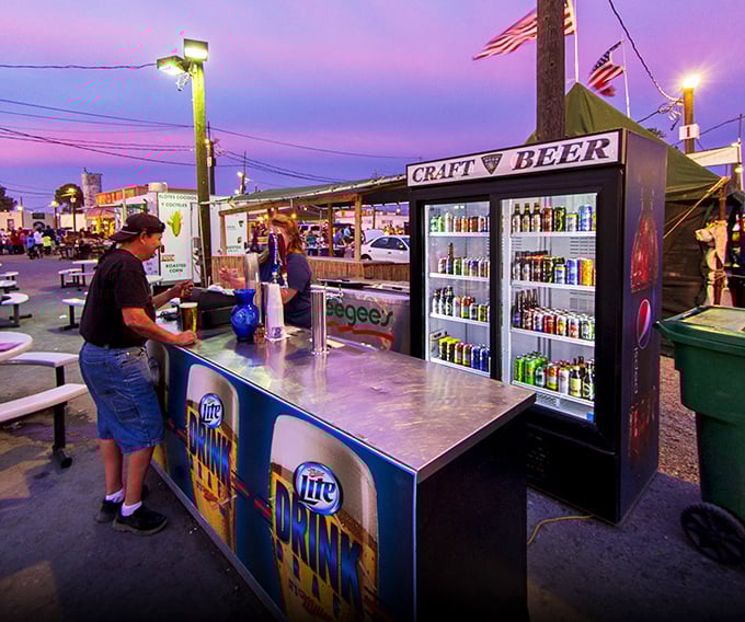As twilight descends, the craft beer stand becomes a desert oasis&mdash;proof that even serious treasure hunting requires proper hydration and occasional adult refreshment.