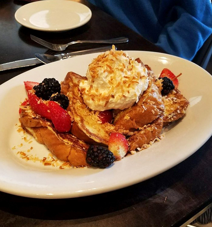 French toast that's dressed for success. The coconut topping and fresh berries transform simple bread into something worth setting an alarm for.