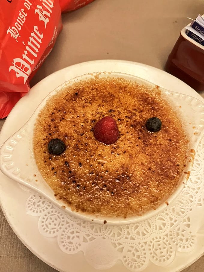 Cr&egrave;me br&ucirc;l&eacute;e with a crackling top that shatters like your diet resolutions. The berries are there to remind you that fruit exists.