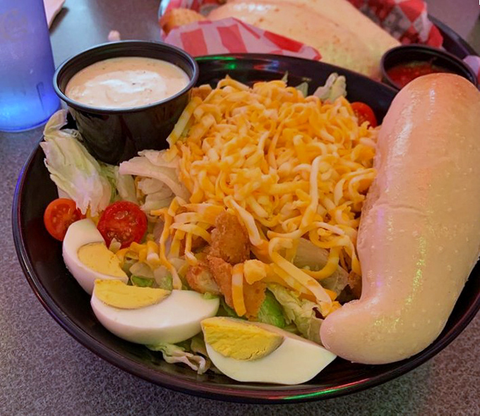 Salads this hearty deserve their own zip code. Crisp lettuce, perfectly boiled eggs, and a mountain of cheese that makes "eating light" feel like an indulgence rather than a sacrifice.