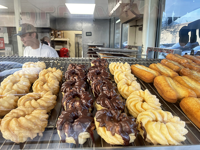 Donut royalty lined up for inspection. These golden-brown beauties could make a French pastry chef question their life choices.