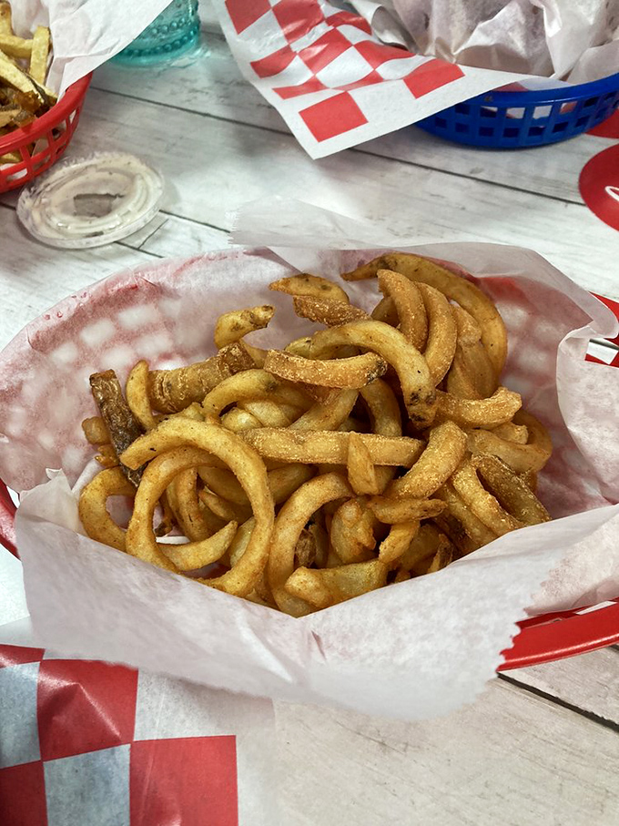 Curly fries: the fun-loving, spiraled cousins of regular fries that make you feel like you're eating something fancy while still being deliciously basic.