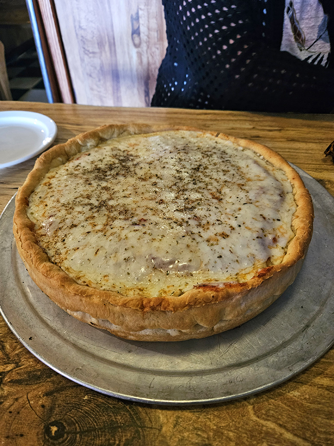 Deep dish pizza becomes a religious experience when cheese stretches like culinary performance art.