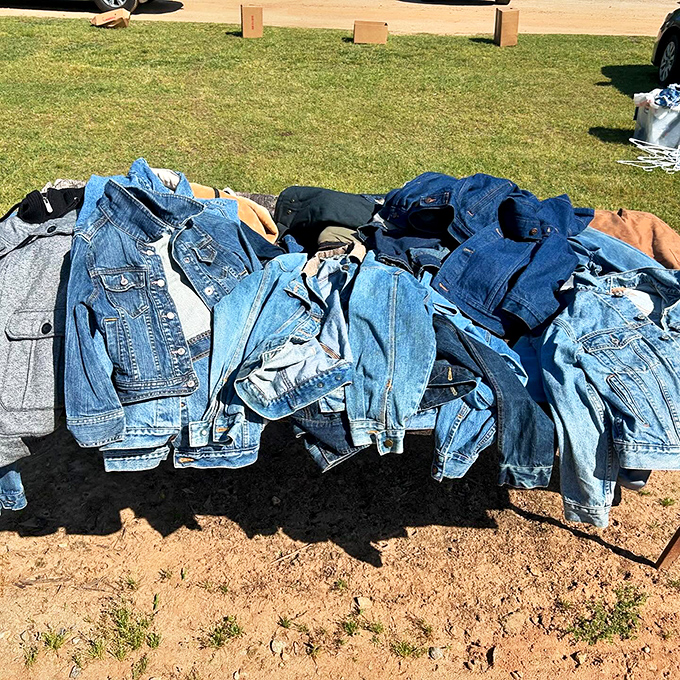Denim heaven spread across the ground—each jacket a canvas of American casual history waiting for its next chapter.