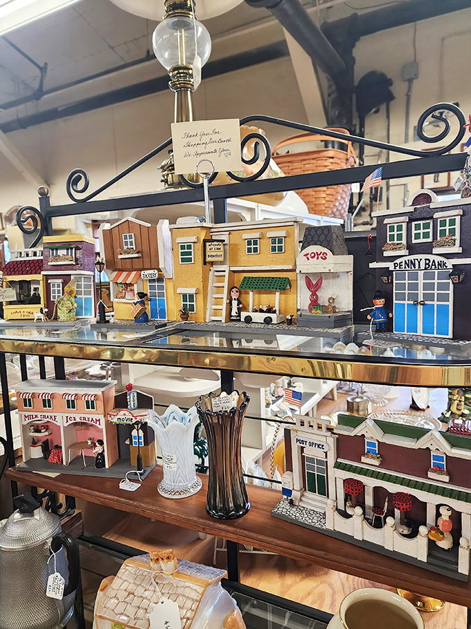 This miniature Main Street display captures America's nostalgic small-town charm in perfect miniature form – complete with tiny milkshake stands and penny banks!