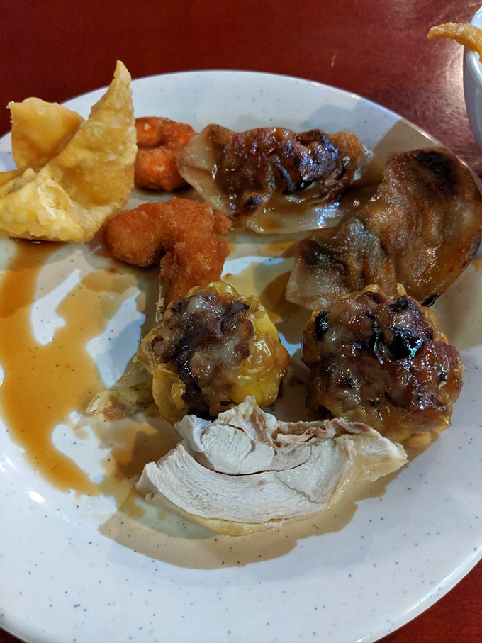 A plate of culinary greatest hits&mdash;crispy wontons, savory dumplings, and tender chicken&mdash;the buffet equivalent of a mixtape for your taste buds.