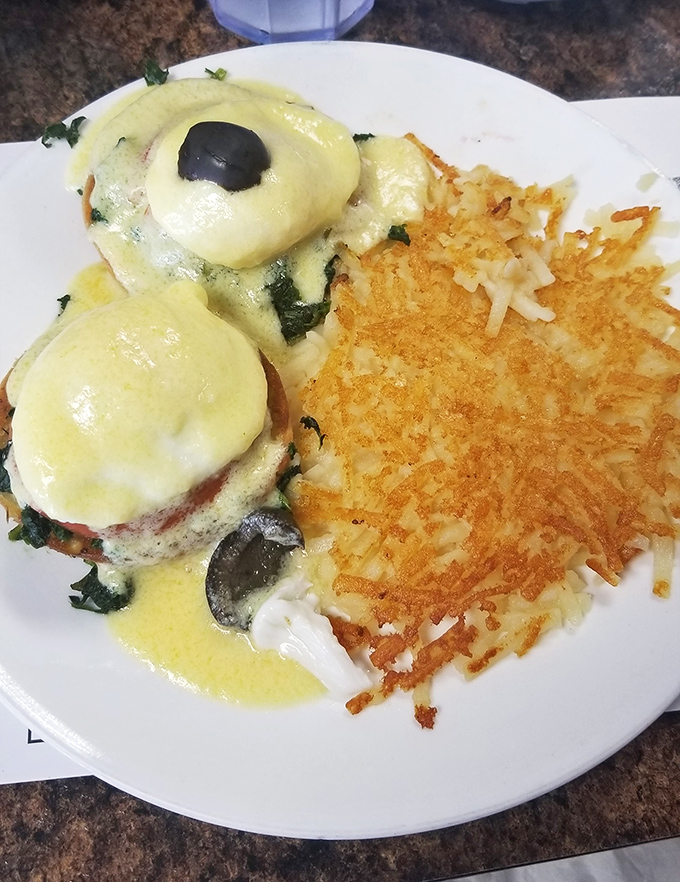 Eggs Benedict with perfectly poached eggs and crispy hash browns&mdash;the breakfast equivalent of finding front-row concert tickets in your coat pocket.