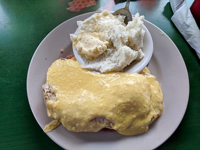 Breakfast nirvana achieved: a golden-topped creation smothered in hollandaise that transforms ordinary mornings into special occasions worth getting out of bed for.