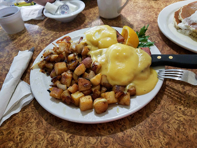 Eggs Benedict: where hollandaise sauce flows like liquid gold over English muffins, creating the breakfast equivalent of winning the lottery without having to share.