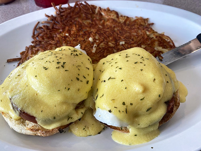 Eggs Benedict with perfectly poached eggs and hollandaise that flows like liquid gold. Hash browns crispy enough to make you forget your table manners.