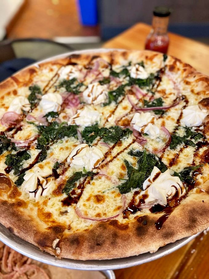 El Blanco proves that sometimes, the absence of red sauce creates a canvas for pure cheese artistry. Those balsamic drizzles are edible calligraphy.