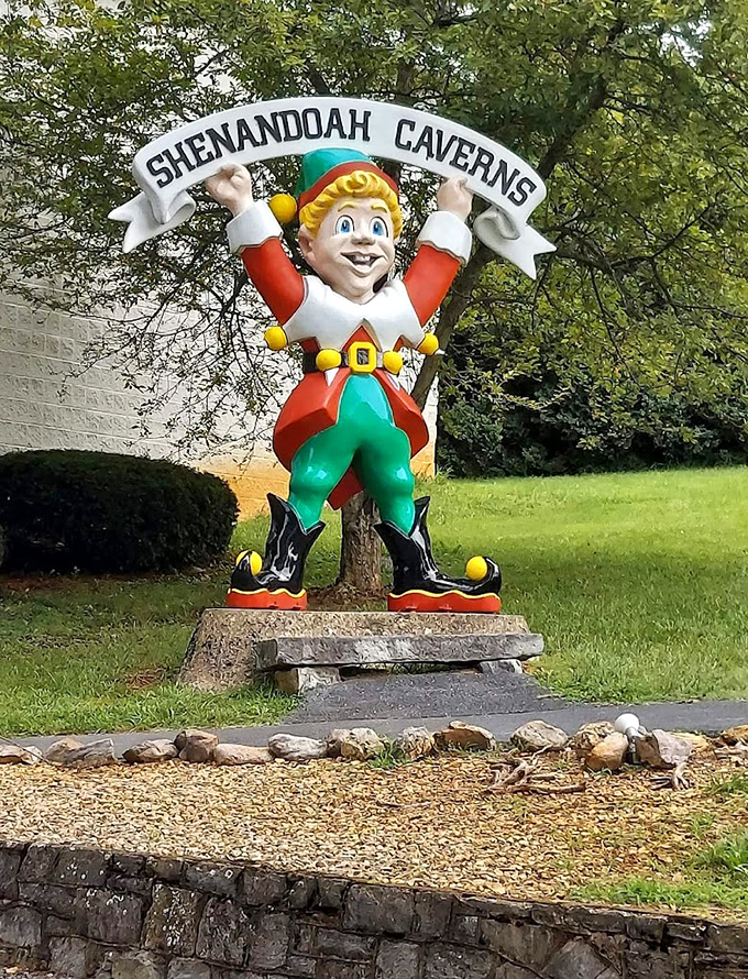 This cheerful elf stands guard outside the caverns, his expression suggesting he knows exactly what wonders lie beneath your feet.