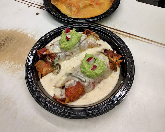 These enchiladas arrive like edible hugs, smothered in sauce and topped with cooling dollops of perfection. 