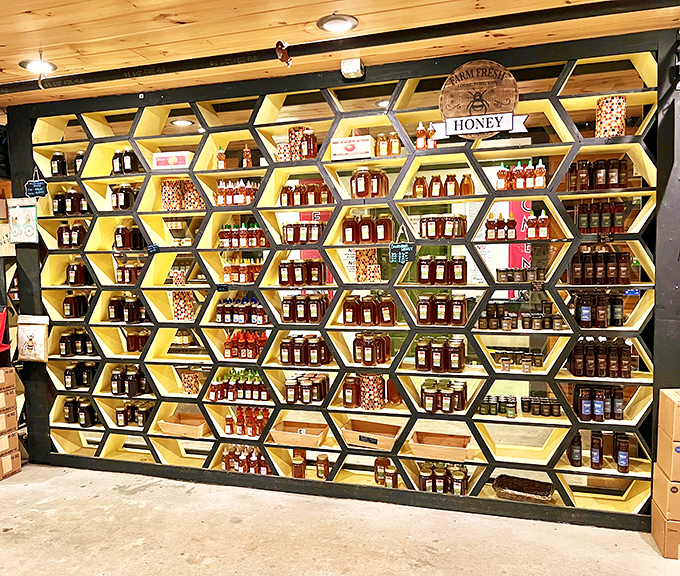 The honeycomb display wall transforms nature's liquid gold into an architectural statement piece that would make both bees and designers proud.