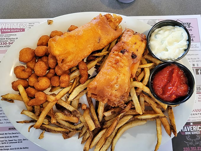 Golden-battered fish that would make Neptune himself swim upstream for a bite, accompanied by an army of crispy fries.