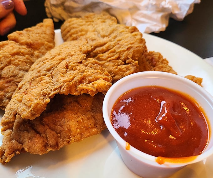 This isn't just fried fish&mdash;it's a crispy-coated love letter to Lake Erie, served with a side of tangy sauce that cuts through the richness perfectly.