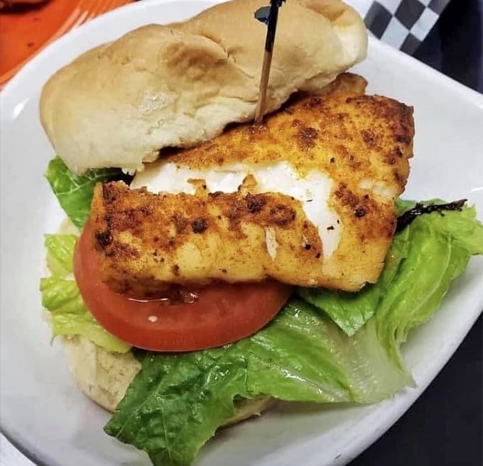 This fish sandwich proves that sometimes the simplest presentations deliver the most satisfying flavor punches.