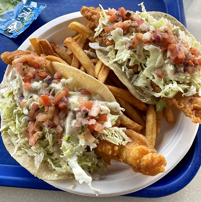 Fish tacos that make Tuesday worth celebrating any day of the week. Fresh cabbage, pico de gallo, and that sauce you'll dream about later.