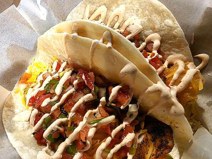 These fish tacos don't need a passport to prove their worth. Fresh pico, creamy sauce, and fish that tastes like it was swimming this morning.