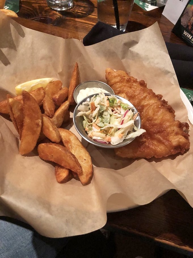 Fish and chips done right &ndash; golden-battered fish with a perfect crunch, chunky chips, and that essential side of slaw.