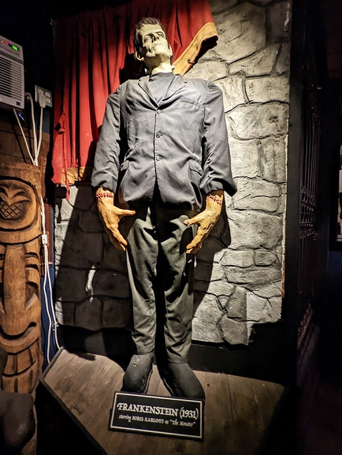 Frankenstein's monster stands tall in his classic pose. He's dressed better than most Austin concert-goers, though his complexion needs work.