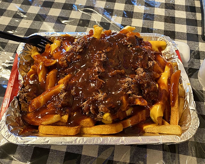 Golden fries topped with pulled pork create a masterpiece that would make Michelangelo weep with joy.