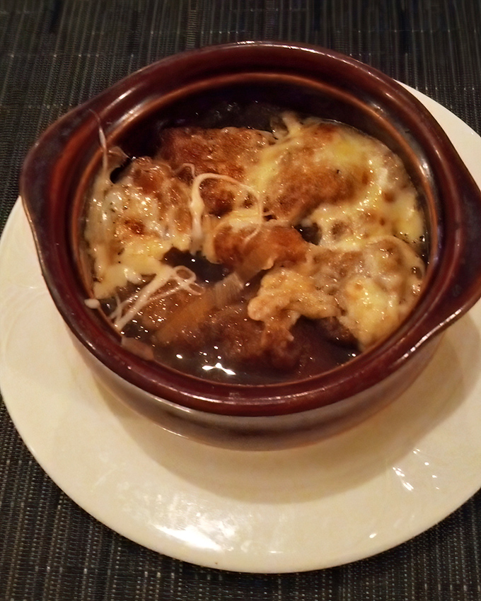 This isn't just French onion soup&mdash;it's a cheese-crowned comfort in a crock, where bread islands float in a savory broth sea.