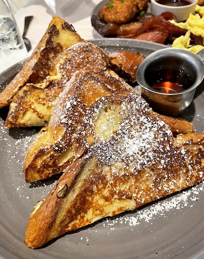 French toast transformed into a powdered sugar wonderland. The kind of breakfast that makes you forget all your adult responsibilities.
