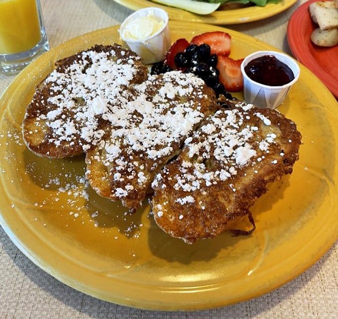 French toast dusted with powdered sugar snow, surrounded by fresh berries&mdash;breakfast masquerading as dessert, and nobody's complaining.