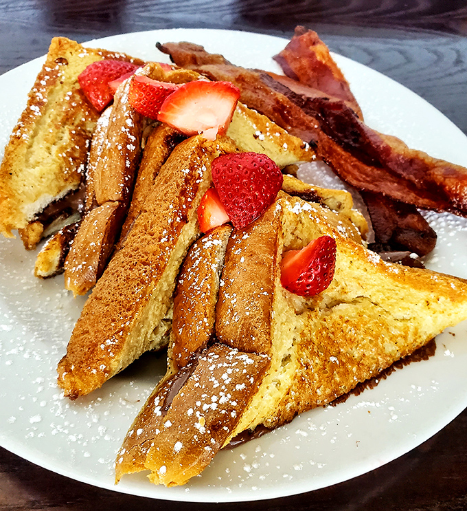 French toast triangles dusted with powdered sugar and crowned with strawberries&mdash;the breakfast equivalent of wearing a tuxedo to the beach.