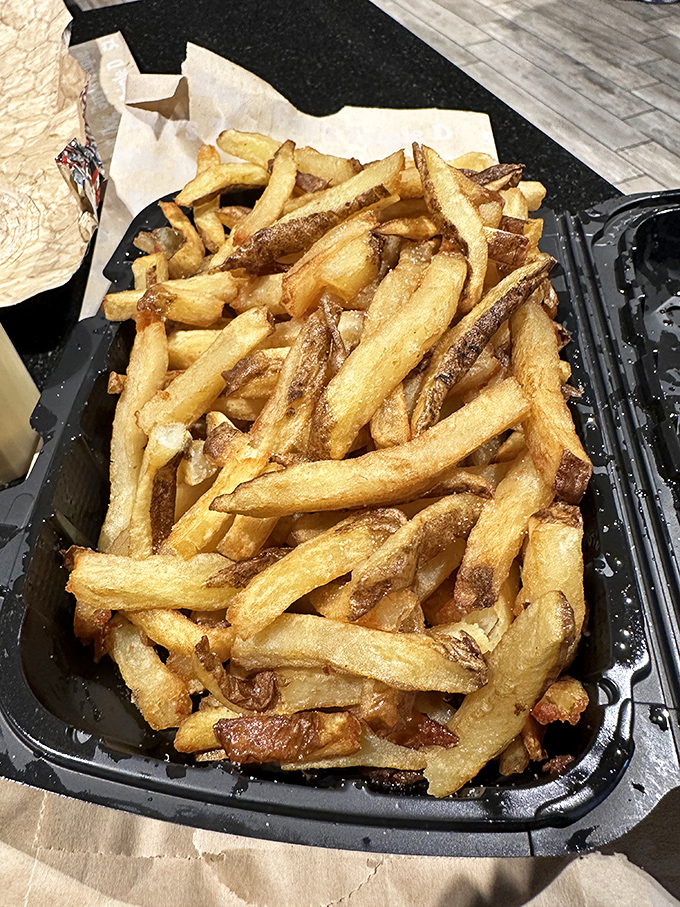 These aren't just french fries—they're the supporting actors that deserve their own Oscar, golden-crisp and ready to soak up any wayward meat juices.