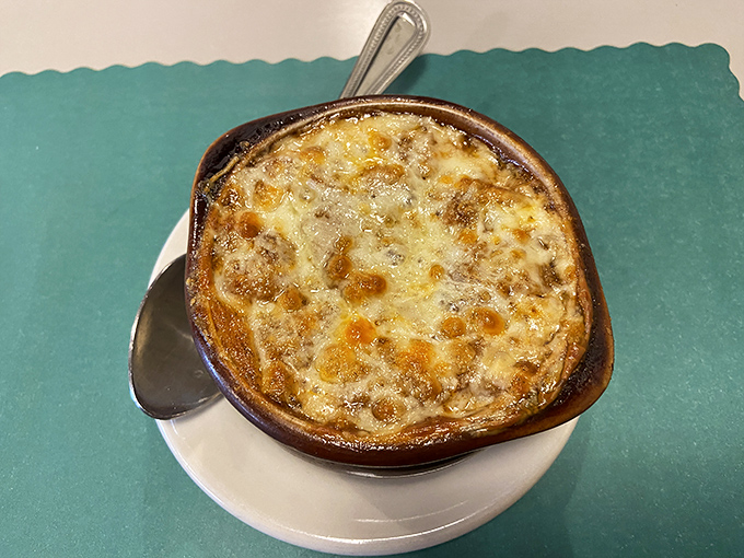 French onion soup that's achieved the perfect cheese-to-broth ratio. That golden crown of bubbling cheese is what comfort food dreams are made of.
