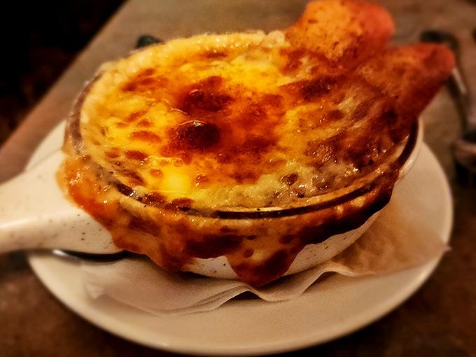 This isn't just French onion soup&mdash;it's a cheese-capped caldron of comfort that demands to be broken into with gleeful abandon.