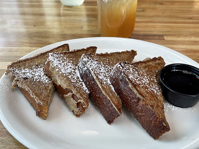 French toast that's dressed for success with a dusting of powdered sugar. The maple syrup is just waiting to create that perfect sweet harmony.