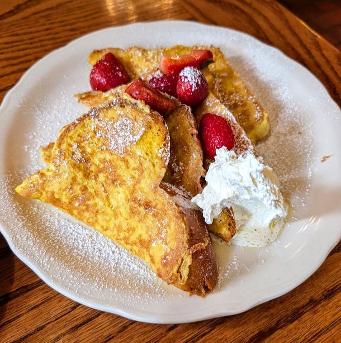 French toast that's crossed the line from breakfast to dessert, with fresh strawberries playing the perfect supporting role.