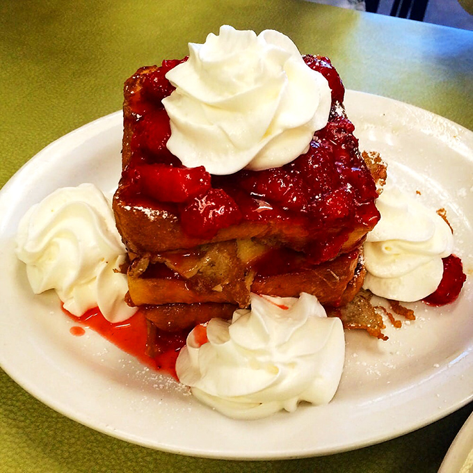 French toast that doesn't know the meaning of restraint, crowned with strawberries and whipped cream that would make Marie Antoinette say, "Now that's what I'm talking about!"