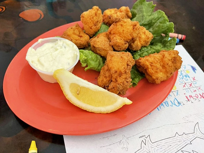 Golden-fried seafood bites that crunch like your favorite childhood memory, served with a dipping sauce that means business.
