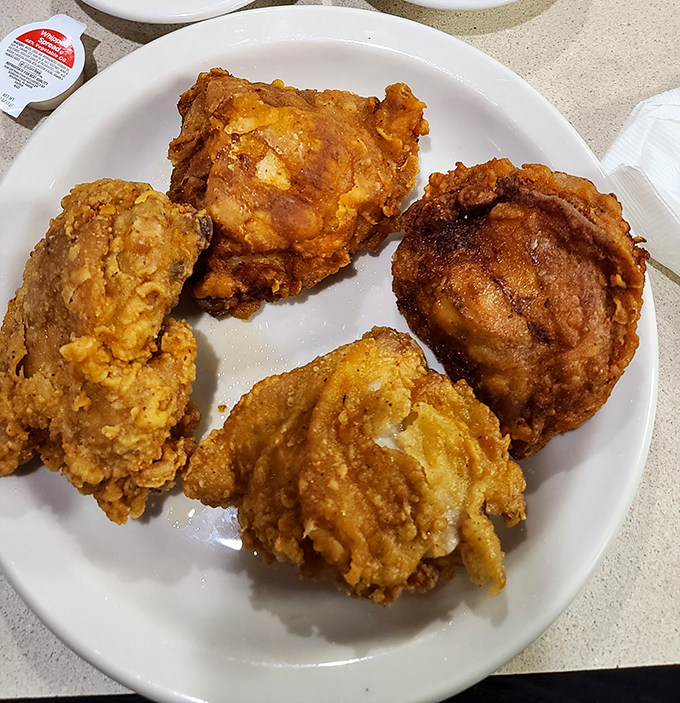 The star of the show: fried chicken with a golden crust that shatters with each bite, revealing juicy meat that makes time stand still.