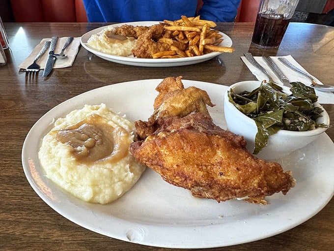 The star of the show: fried chicken with sides that know their supporting role. Those collard greens have stories to tell.
