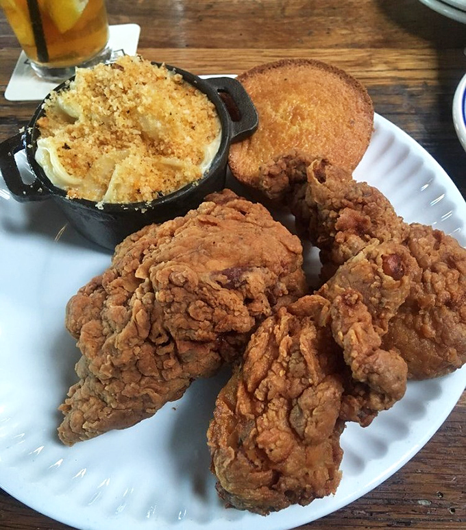 Fried chicken that achieves the impossible trifecta: shatteringly crisp exterior, juicy interior, and seasoning that makes you wonder why you ever ate anything else.
