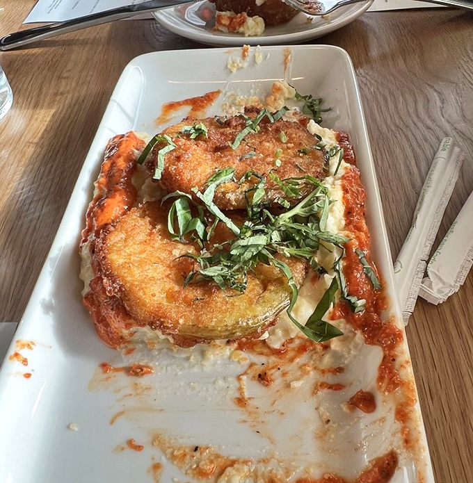 Fried green tomatoes&mdash;the South's gift to the culinary world. Crispy, tangy discs nestled in creamy sauce that'll make you question why you ever ate tomatoes any other way. 