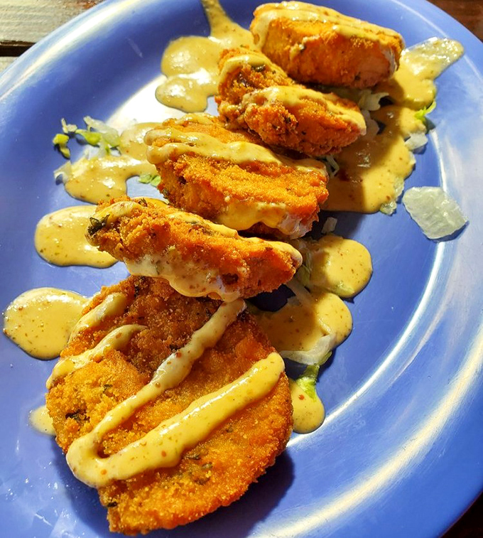 Golden-fried delights drizzled with creamy sauce&mdash;proof that sometimes the simplest preparations create the most memorable bites.