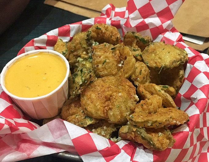 Fried pickle spears that deliver the perfect crunch-to-tang ratio, with cheese sauce that's basically saying, "You're welcome" before you even taste it.