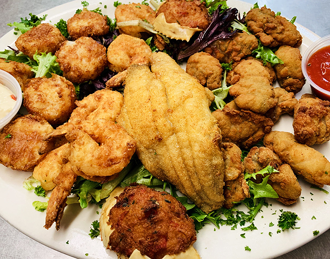 The fried seafood platter that makes diets weep and taste buds rejoice. Golden-brown perfection that's worth every napkin you'll need.