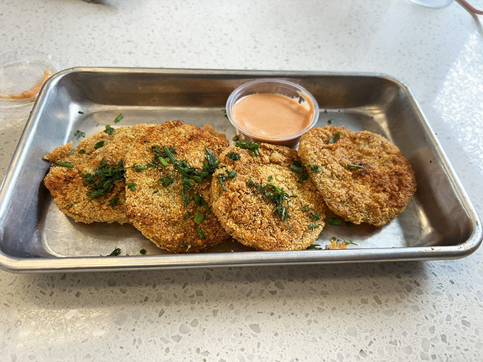 Fried green tomatoes with a side of comeback sauce&mdash;proof that unripe fruit can become something transcendent when treated with respect and hot oil.