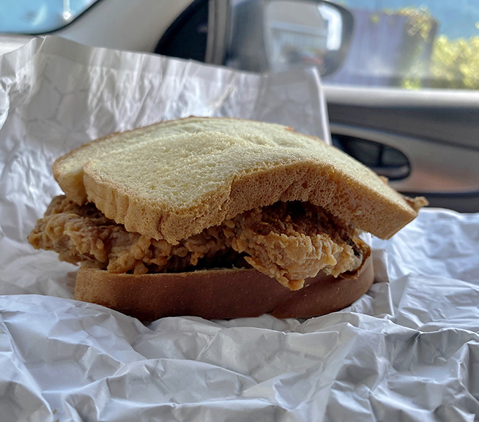 The humble pork chop sandwich: where bread meets meat in a beautiful union that requires nothing more than hungry hands and zero pretension.