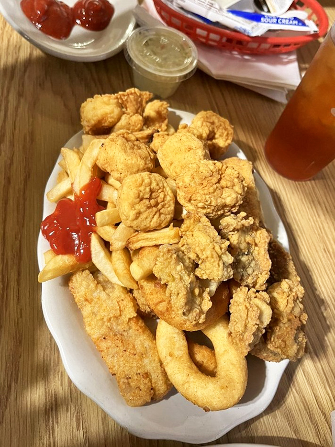 A seafood medley that puts ordinary platters to shame&mdash;crispy rings, tender nuggets, and fries creating the holy trinity of fried goodness.