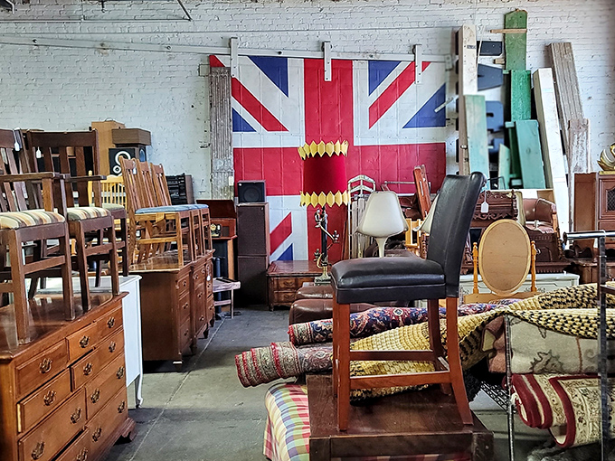 The Union Jack stands guard over a furniture battalion. This isn't just secondhand shopping—it's international time travel without the passport.