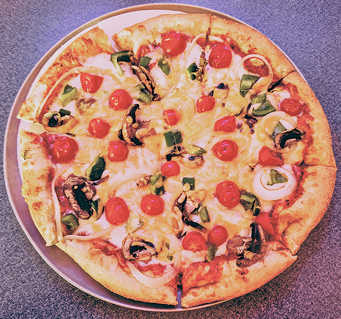 Garden pizza that actually tastes like a garden&mdash;bright cherry tomatoes, fresh green peppers, and mushrooms arranged not by accident but with purpose and respect.